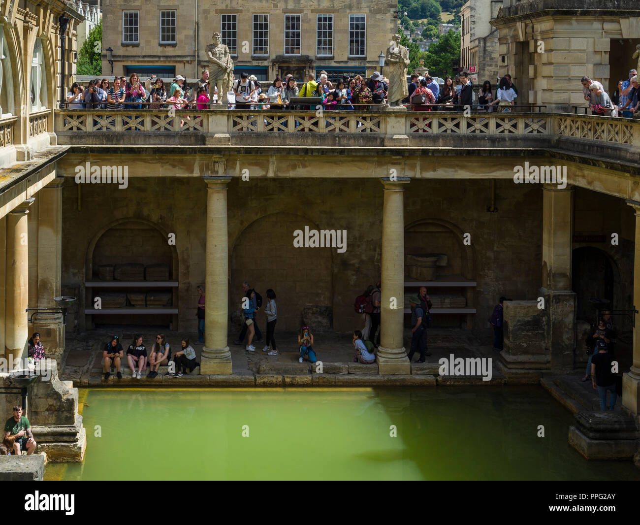 Visitors exploring the Terrace and Great Bath of the Roman Baths, in ...
