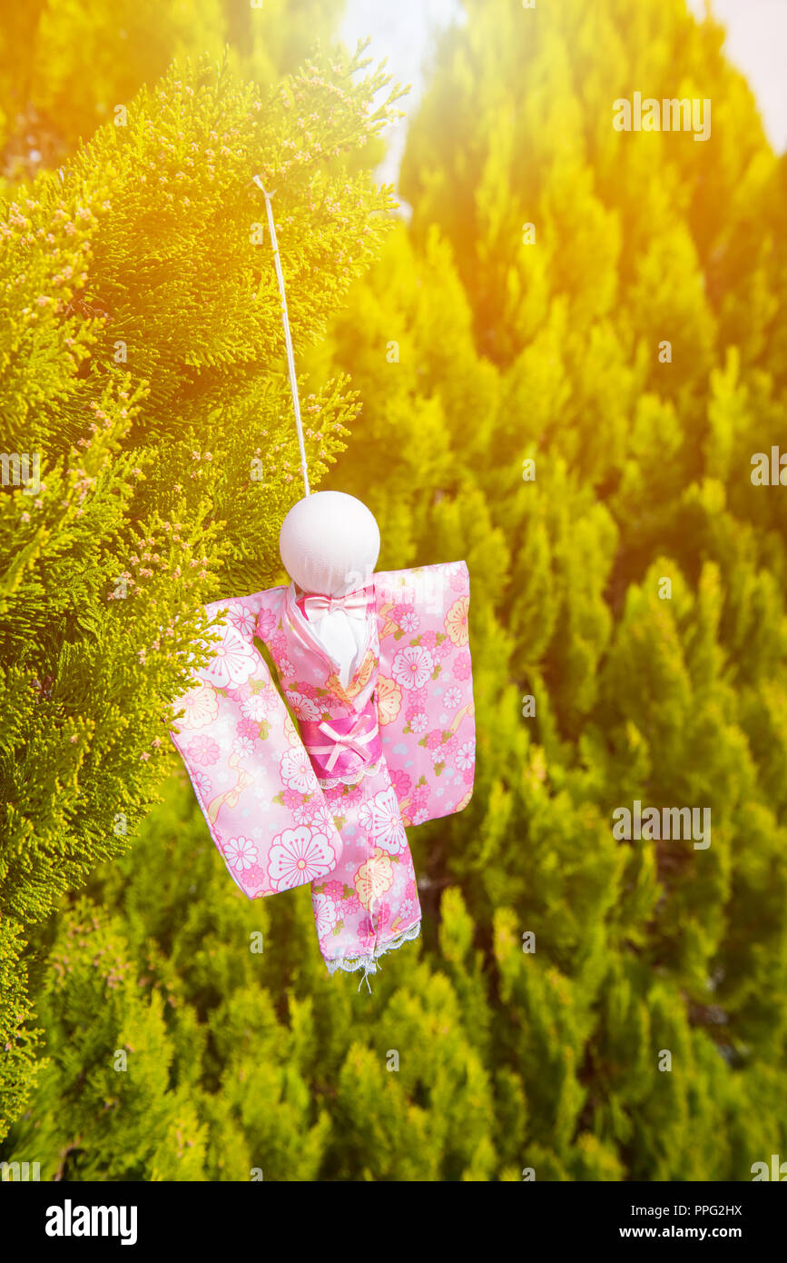 Teru Teru Bozu. Japanese Rain Doll wearing kimono, hanging on tree to ...