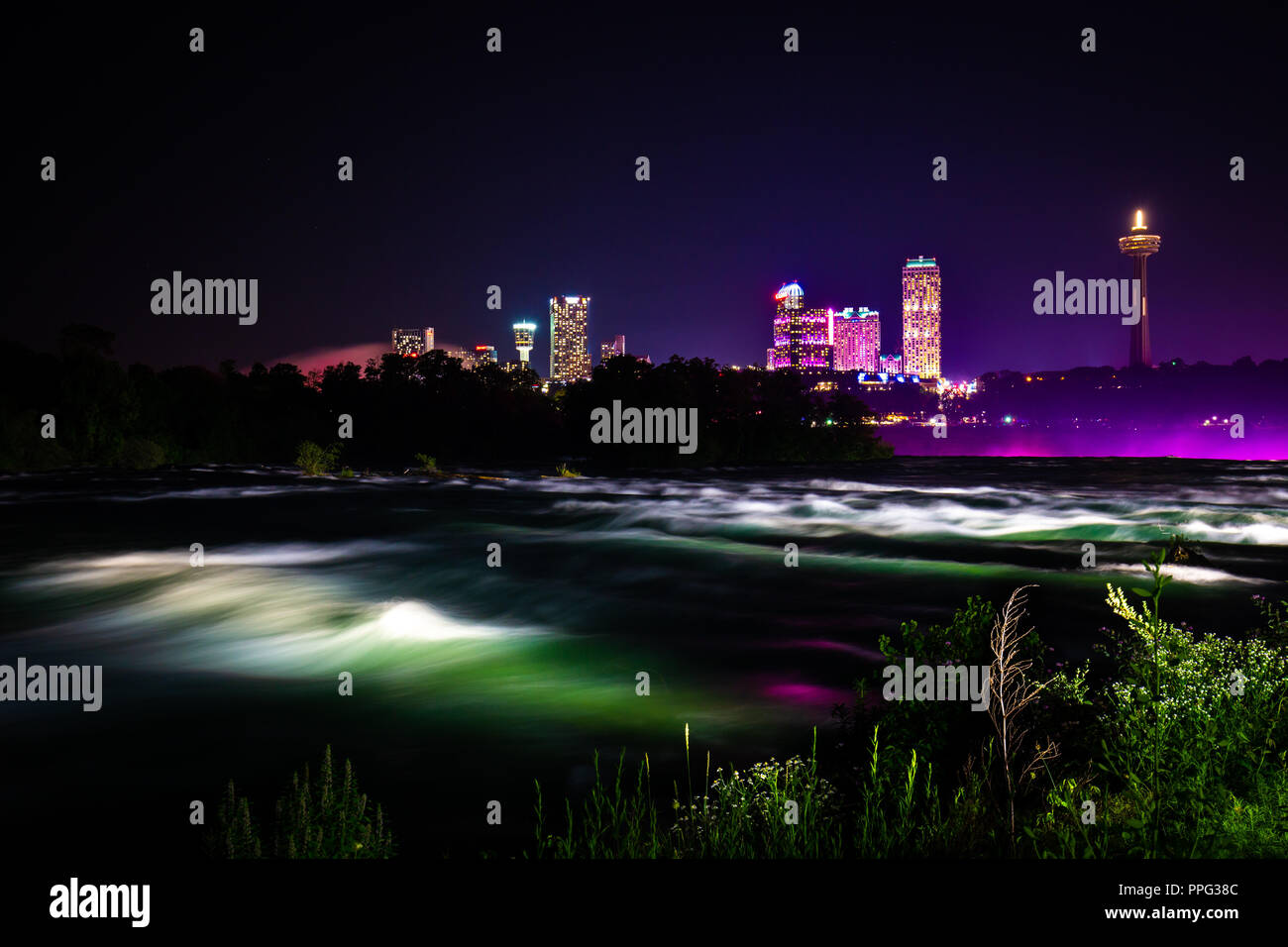 NIagara falls illuminated with color lights at night view Stock Photo ...