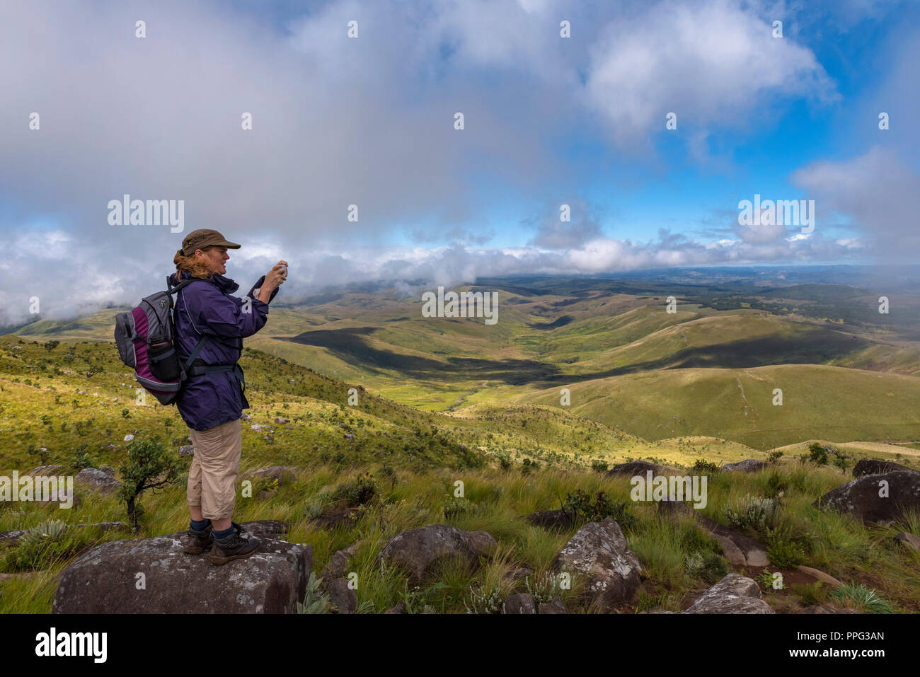 A hikers climbs the slopes of Mt Inyangani in Zimbabwe's Rhodes Nyanga ...