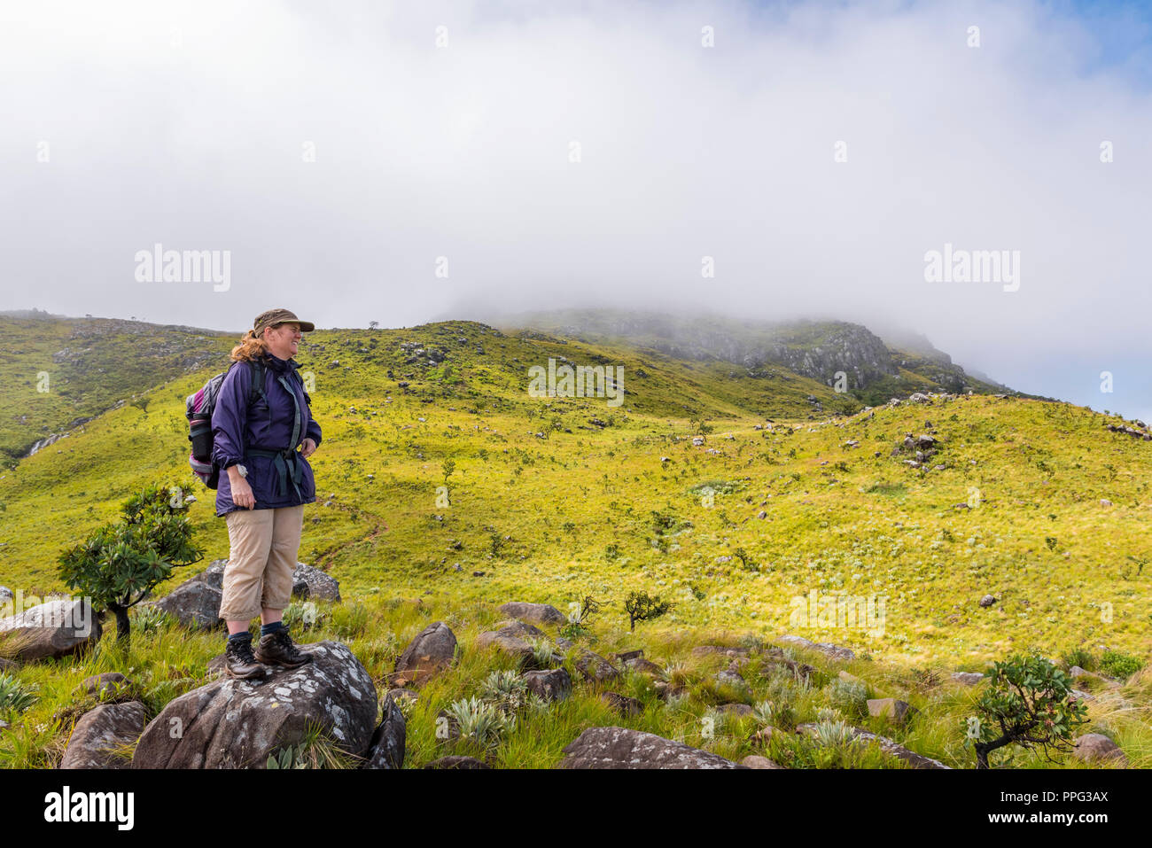 A hikers climbs the slopes of Mt Inyangani in Zimbabwe's Rhodes Nyanga ...