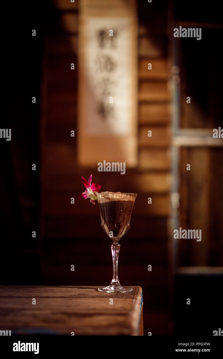 Medium shot of specialty drink with decorative flower Stock Photo - Alamy