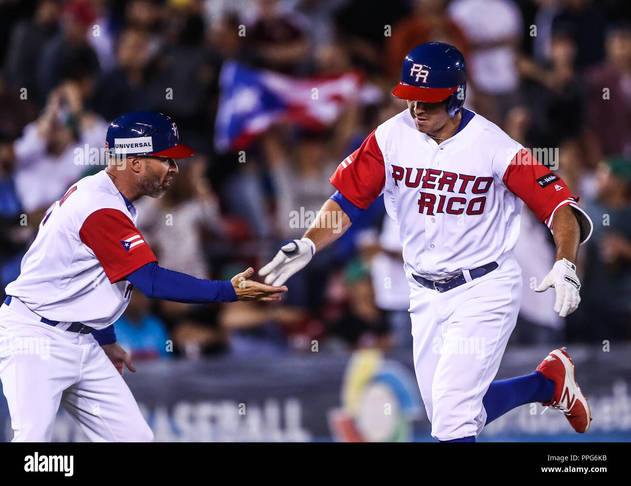 T.J. Rivera (5) corre para anotar la carrera 11 de Puerto Rico, durante ...