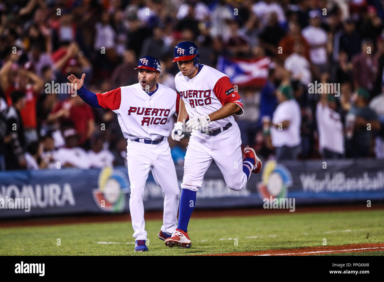 T.J. Rivera (5) corre para anotar la carrera 11 de Puerto Rico, durante ...
