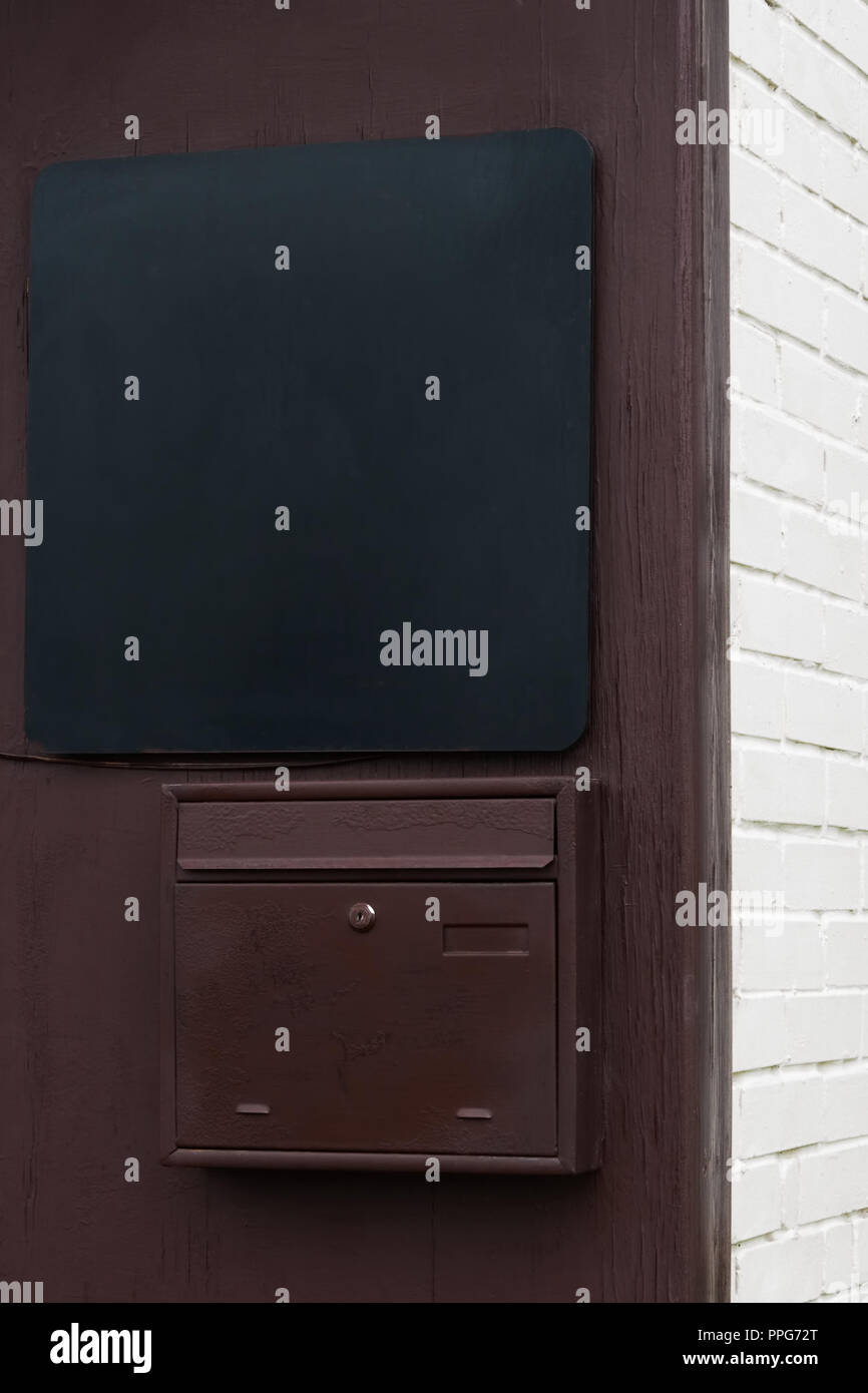 Mailbox with an empty board on an old wall Stock Photo - Alamy
