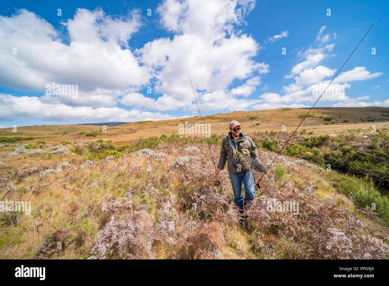A fly fisherman plies the wild rivers of Nyanga National Park in ...