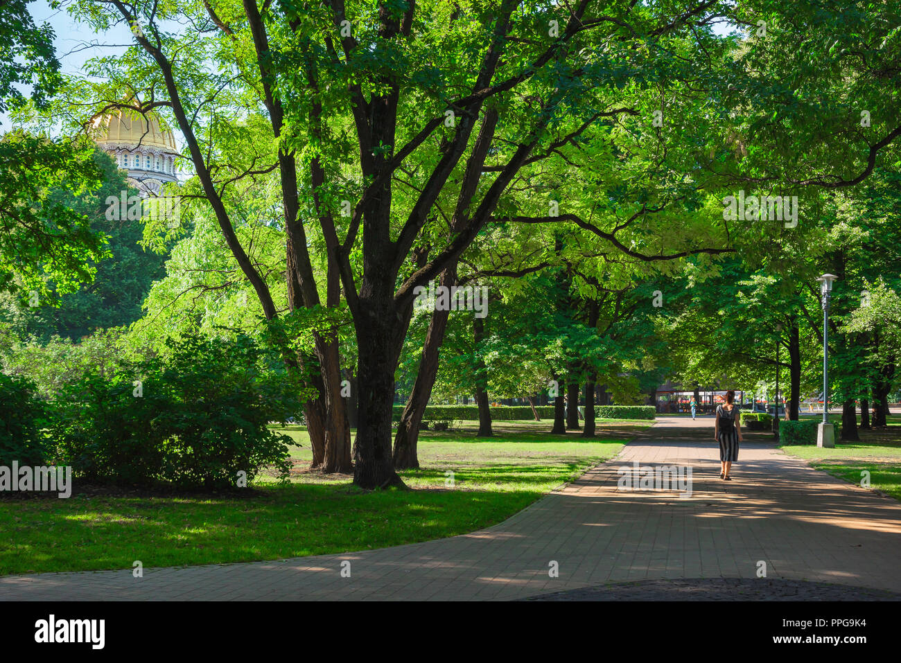 Esplanade park Riga, view in summer of people walking in the Riga ...