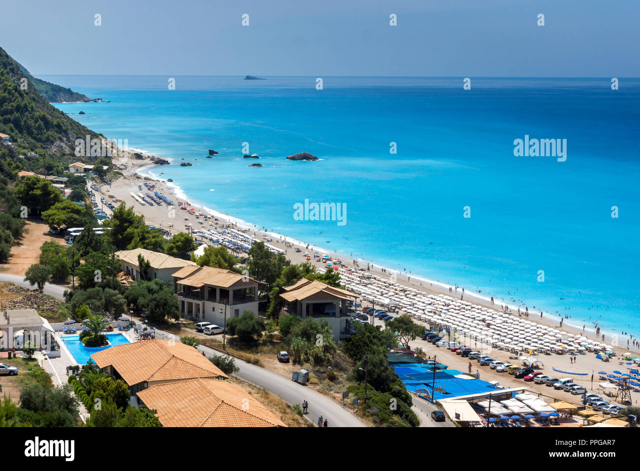 KATHISMA BEACH, LEFKADA, GREECE - JULY 16, 2014: Tourists at Kathisma ...