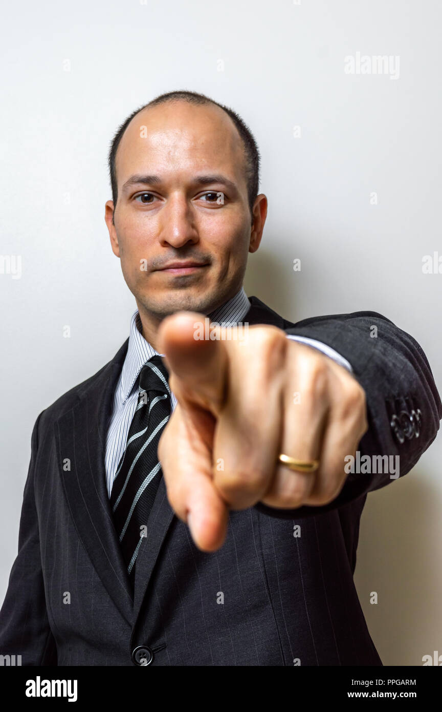 Pointing to tie studio hi-res stock photography and images - Alamy