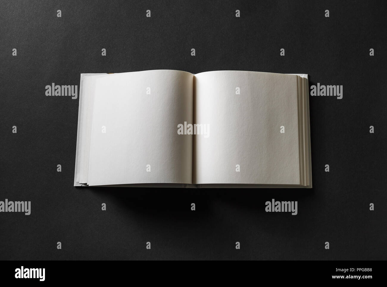 Blank open book on black background. Responsive design mockup Stock ...
