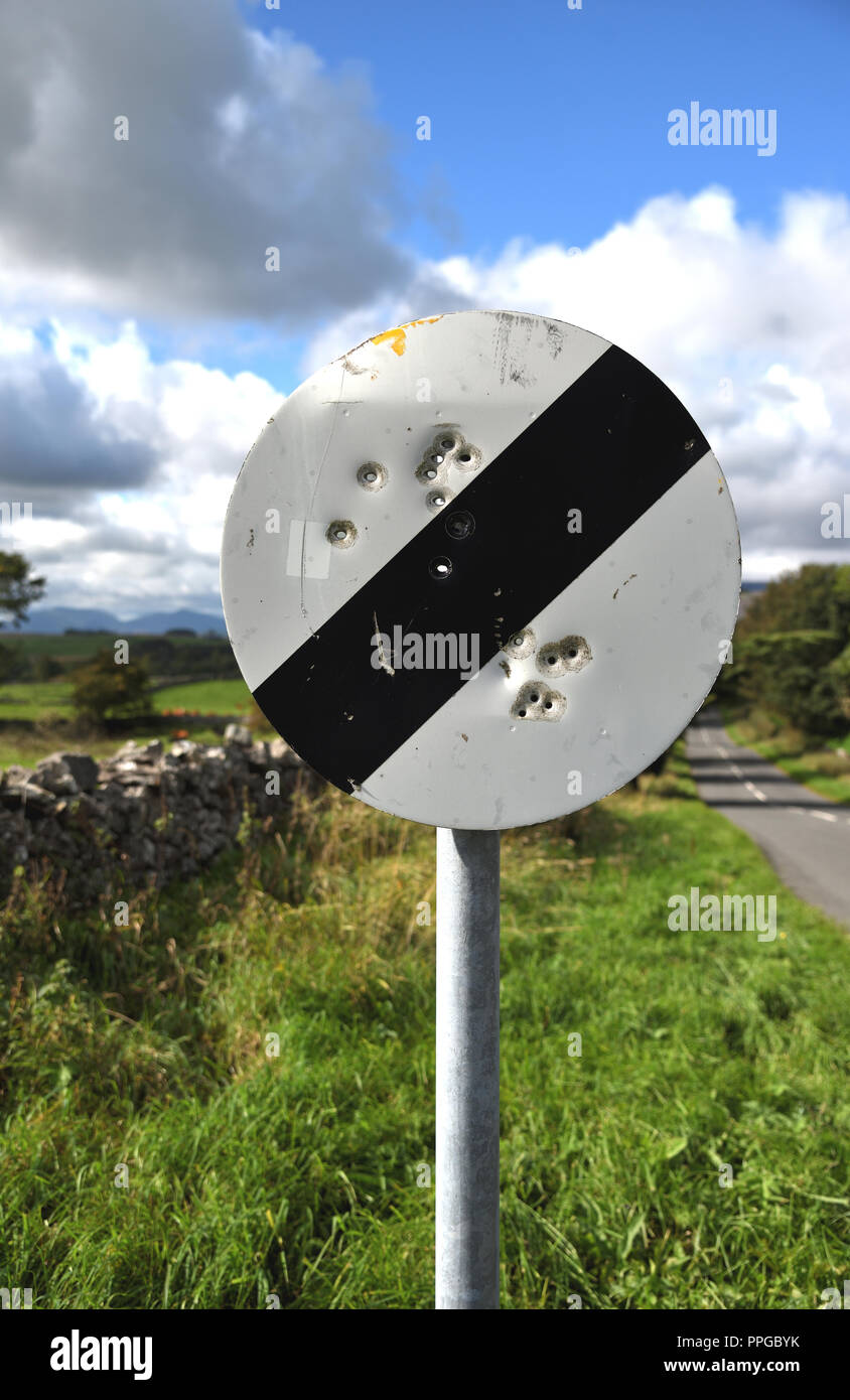 Sign with bullet holes hi-res stock photography and images - Alamy