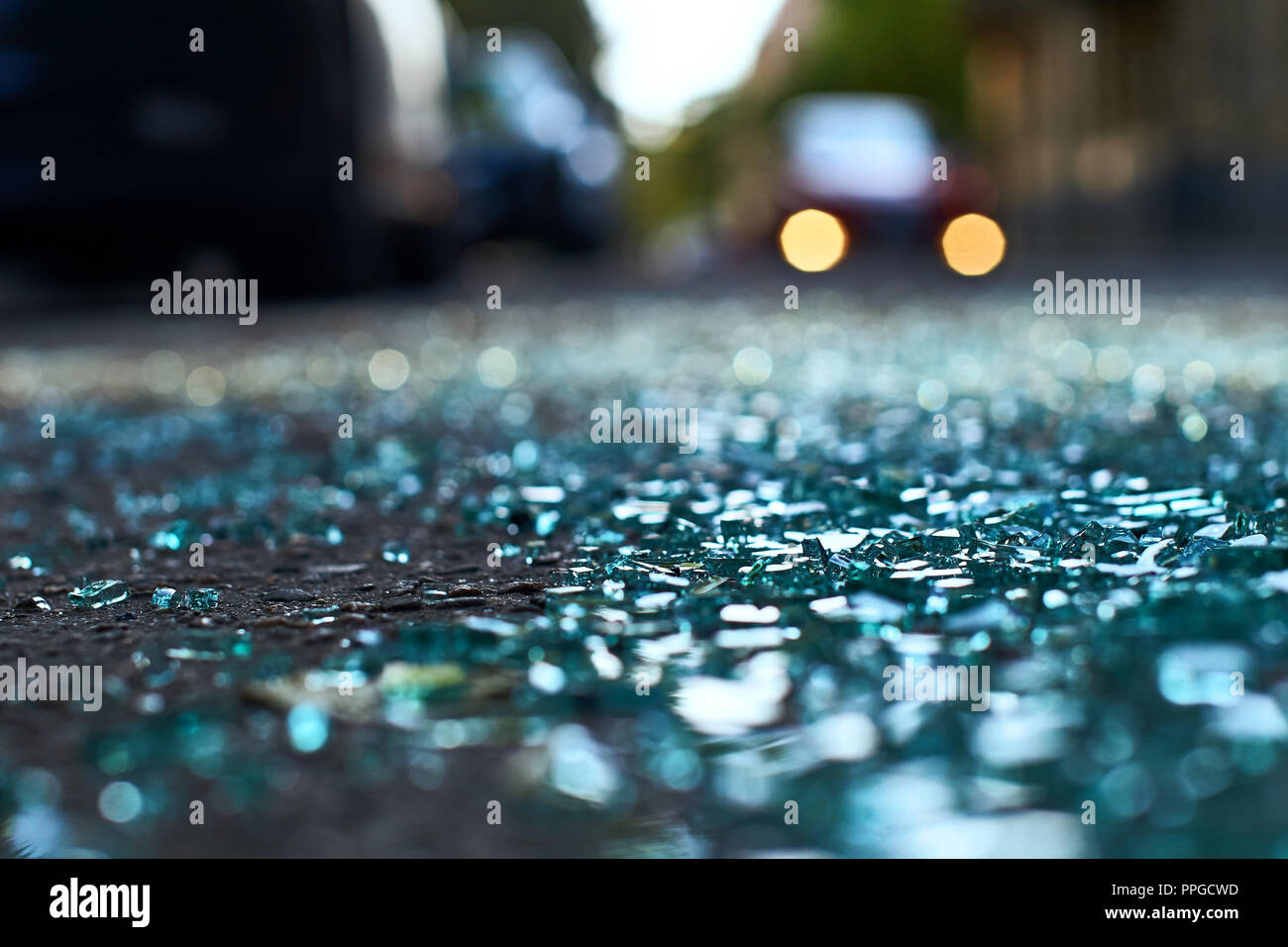 Shards of car glass on the street Stock Photo - Alamy