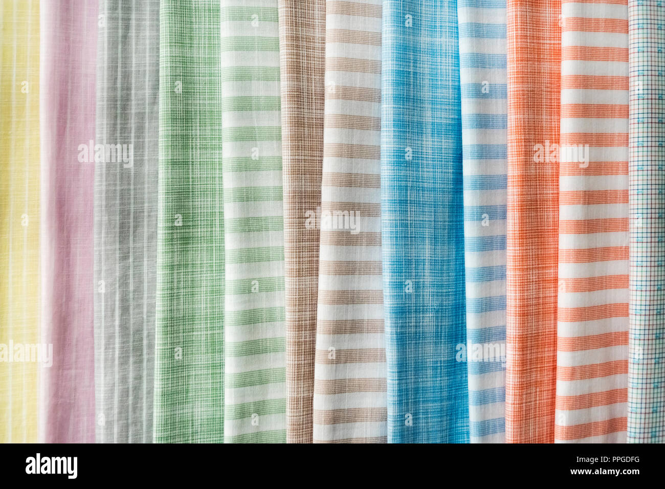 Samples of fabric - flax of different colors on the display case Stock ...