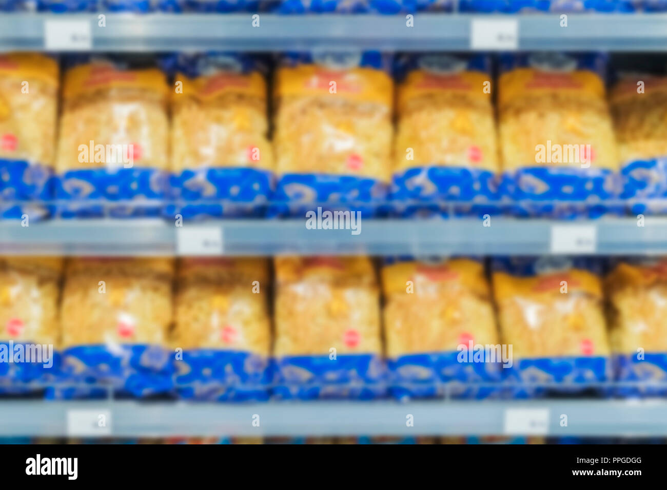 Blurred pasta lying on the shelf of the store with a price tag Stock ...
