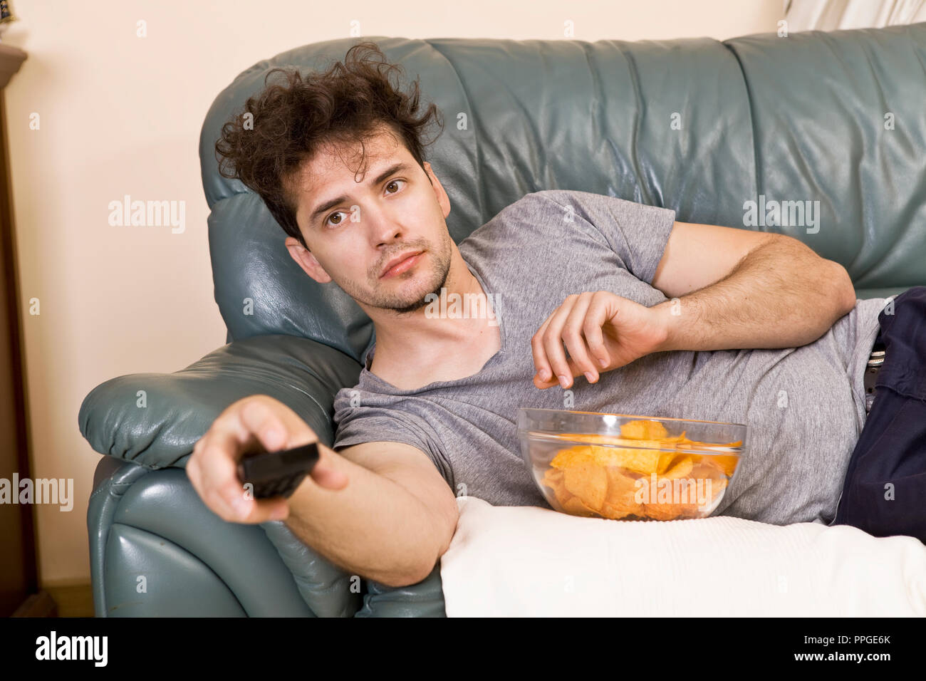 Man eating potato chips hi-res stock photography and images - Alamy