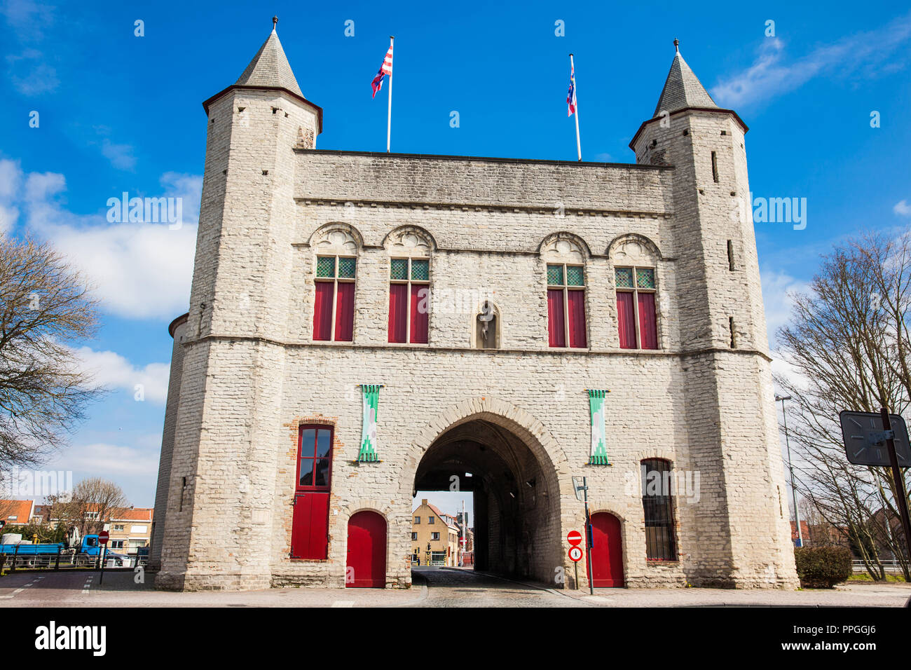 The antique Cross gate of the ramparts in the historical town of Bruges ...