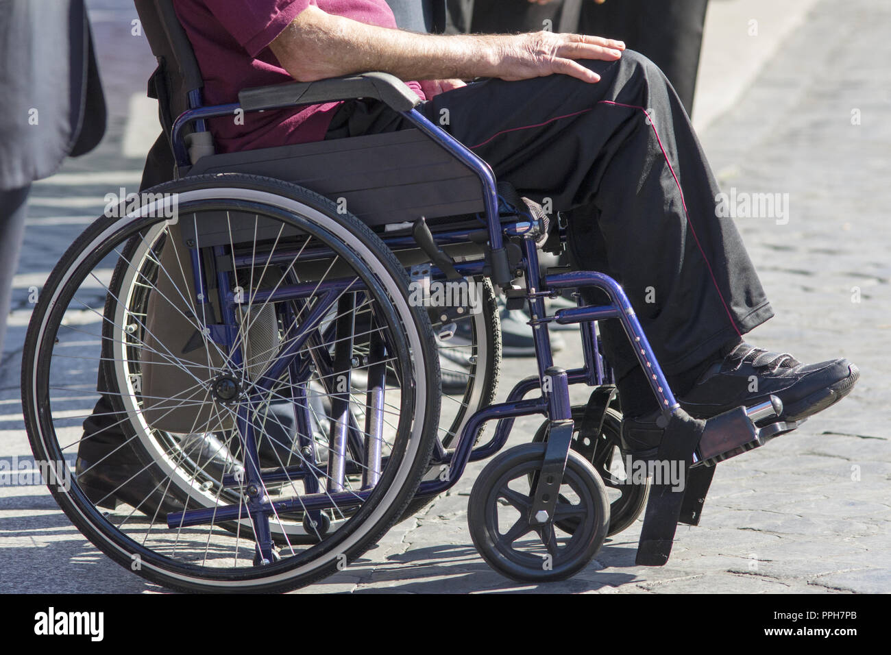 invalid man sitting on a wheelchair Stock Photo - Alamy
