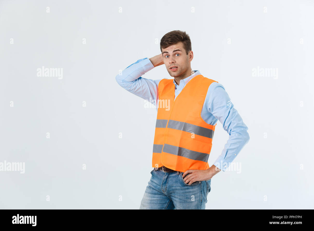 Serious engineer standing with looking away studio shot isolated on ...