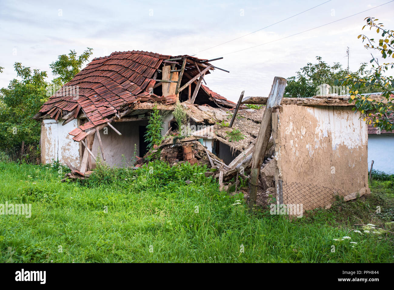 Old destroyed house in the village Stock Photo - Alamy