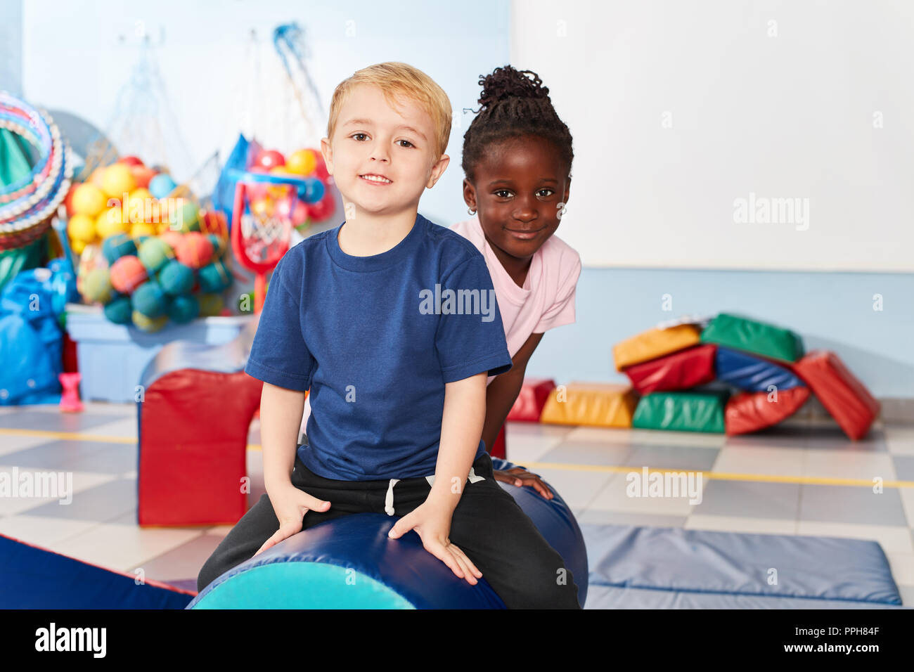 Young and African girl in the gym in multicultural kindergarten Stock ...