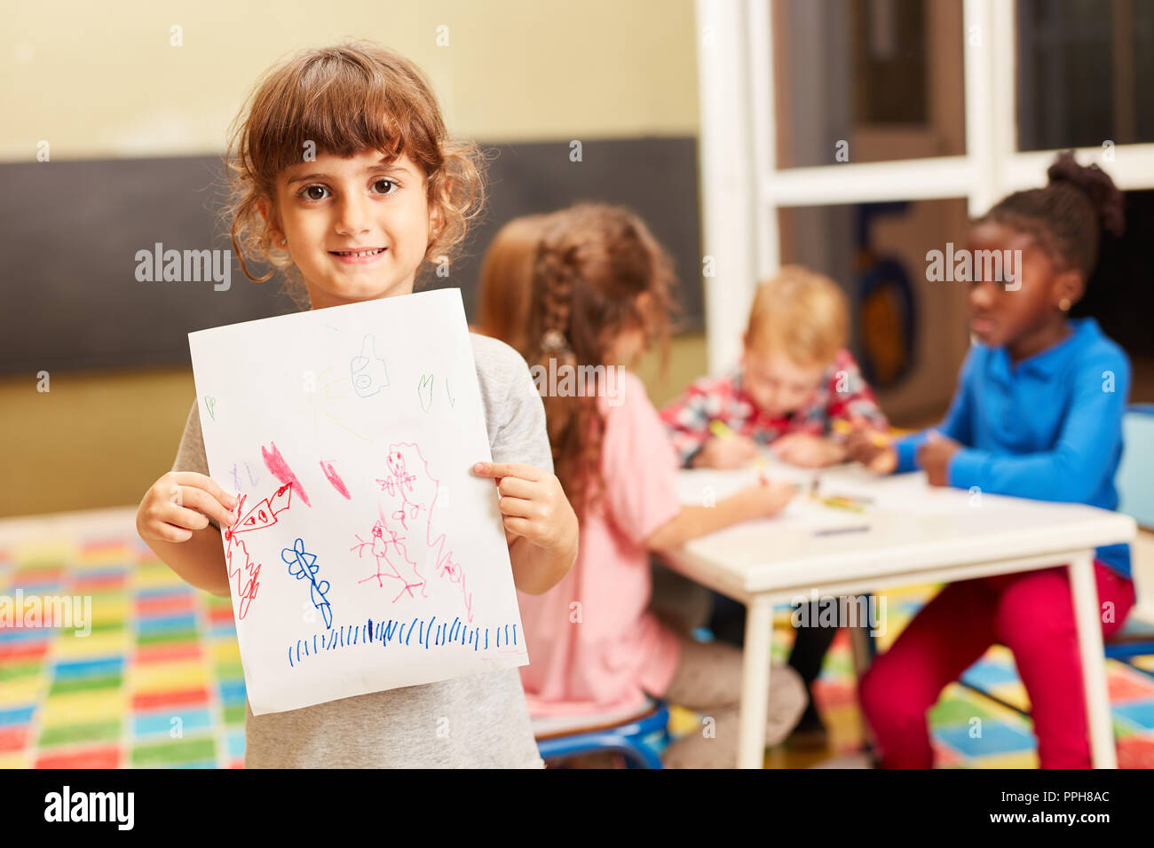 Girl in the drawing group shows a drawing full of imagination and ...