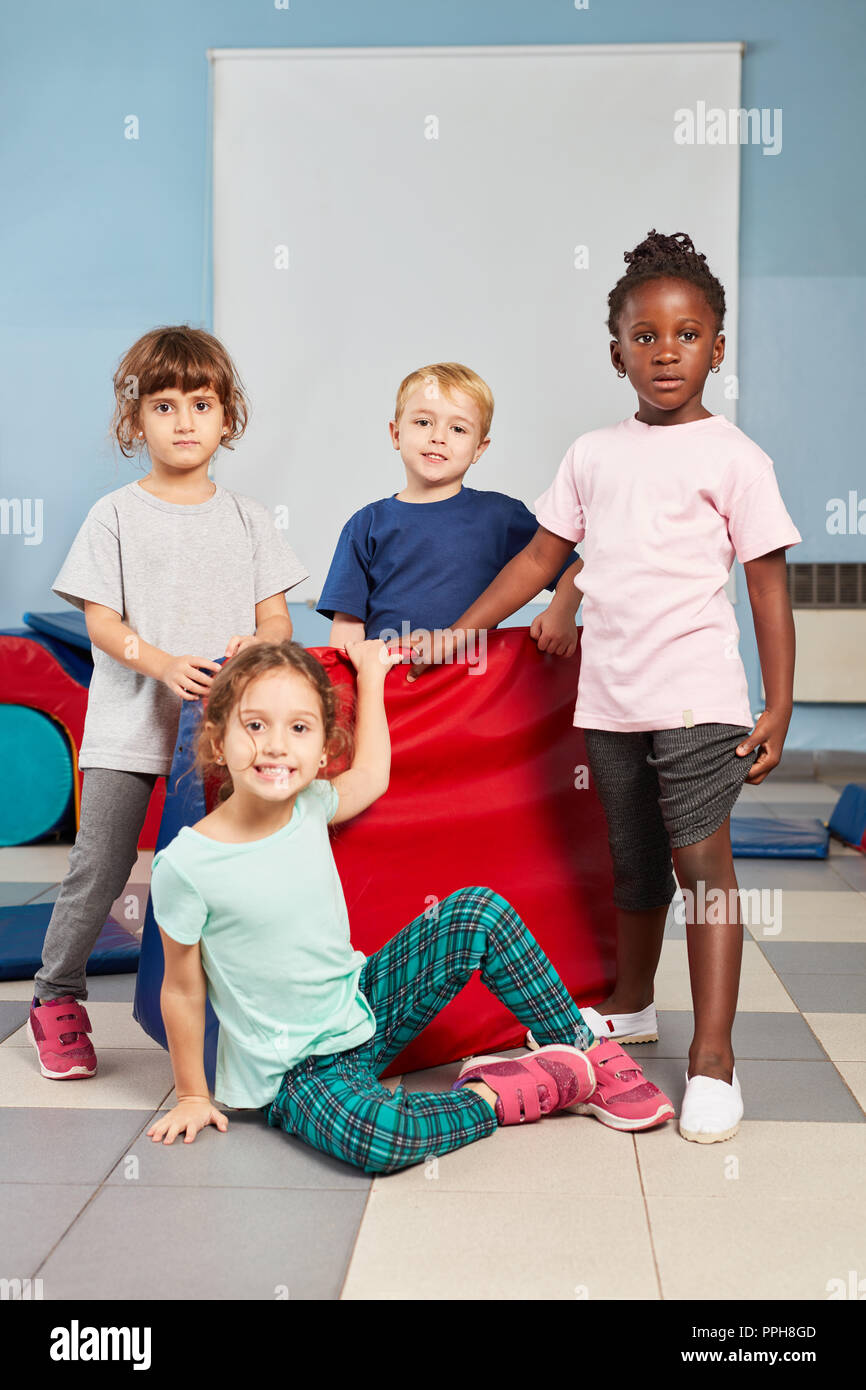 Group of multicultural kids in the gym of preschool or kindergarten ...
