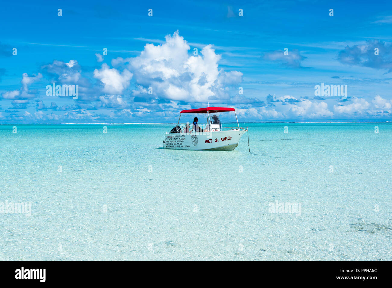 Maina Island, The Cook Islands--March 14, 2018. A party boat is ...