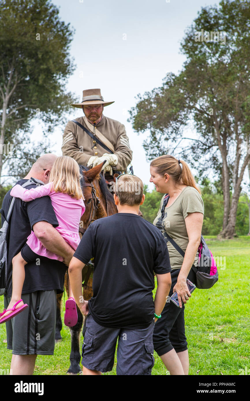 A family of Spectators meet a Southern confederate soldier on horseback ...
