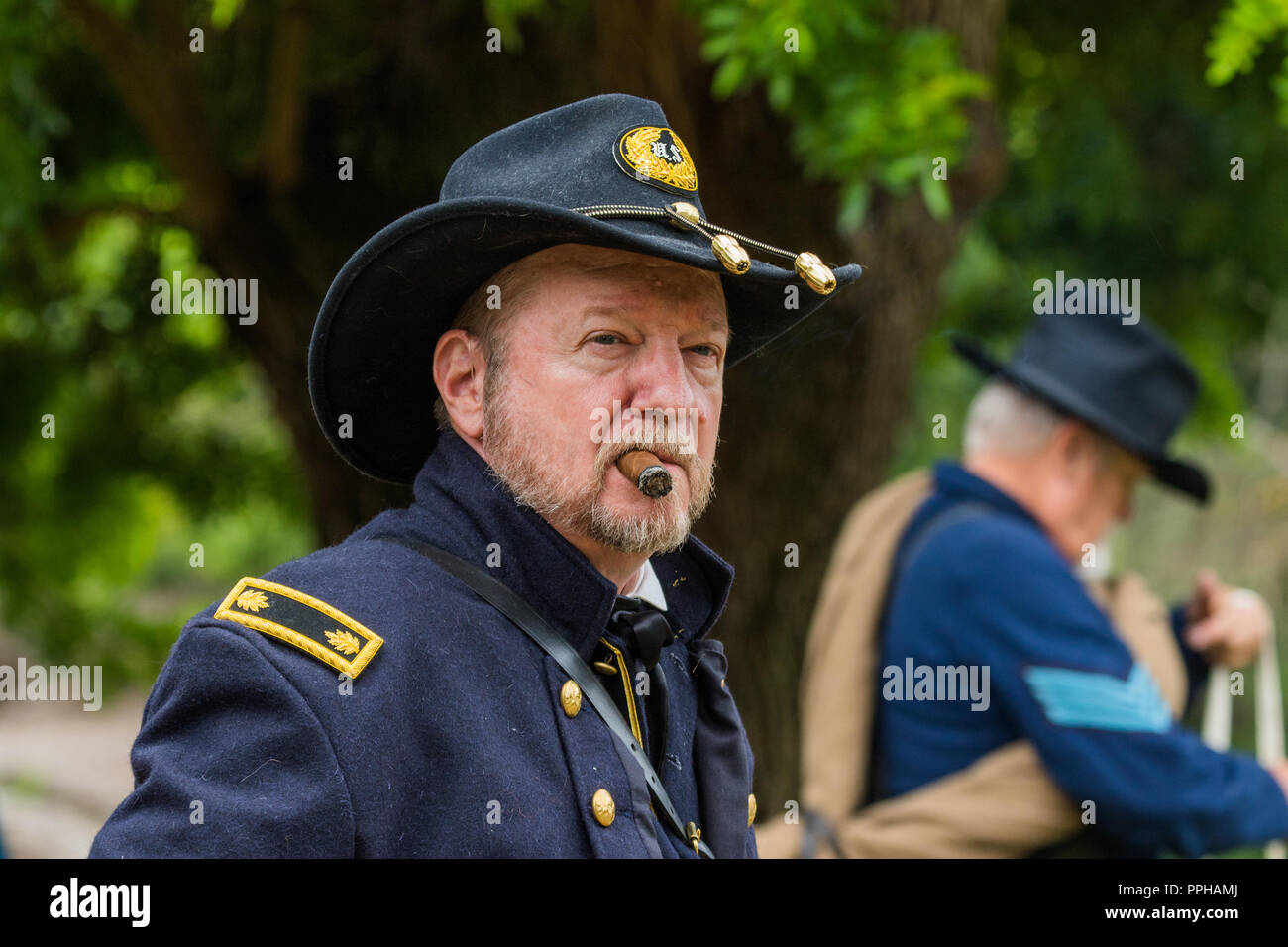 American union army soldier at a American Civil war reenactment smoking ...