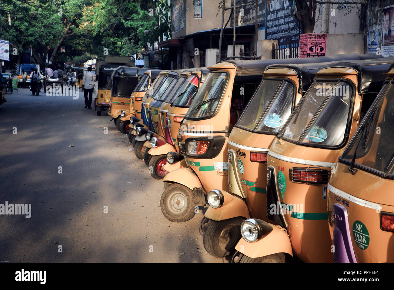 Yellow tuk tuk auto rickshaw taxis parked waiting for passengers in ...