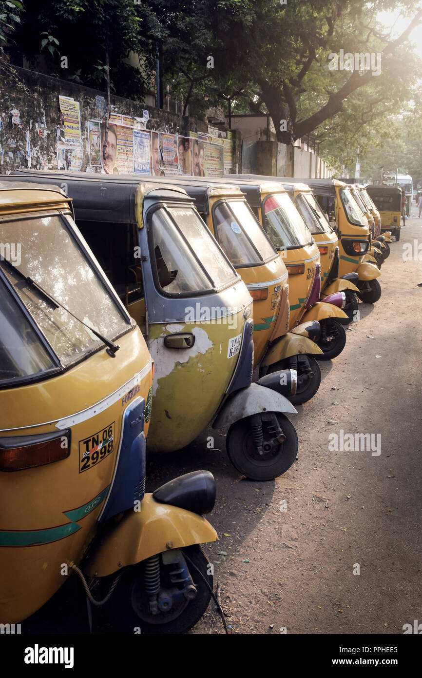 Yellow tuk tuk auto rickshaw taxis parked waiting for passengers in ...