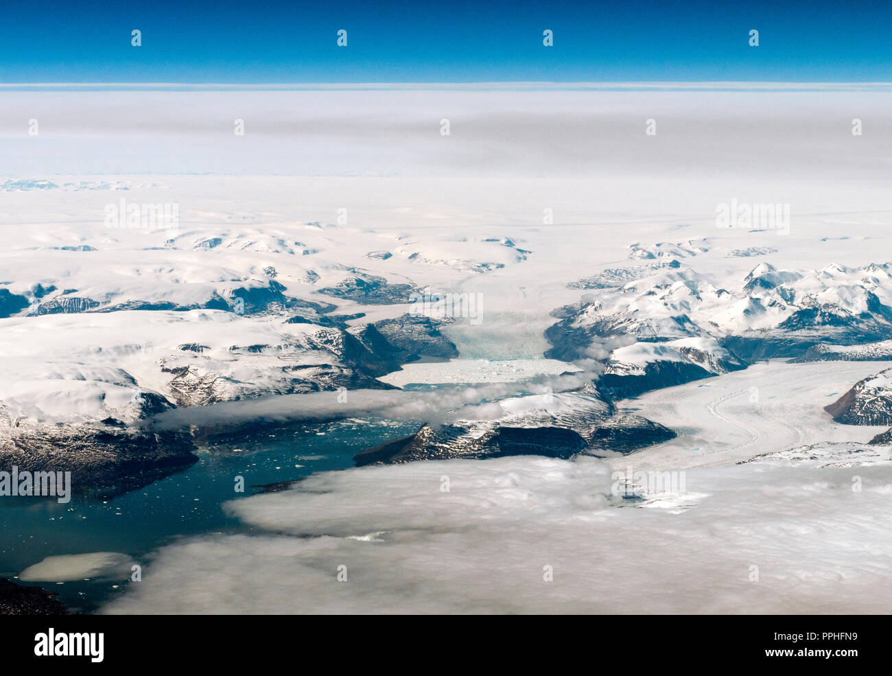 Aerial view of Greenland and it's terrain including glaciers, waterways ...