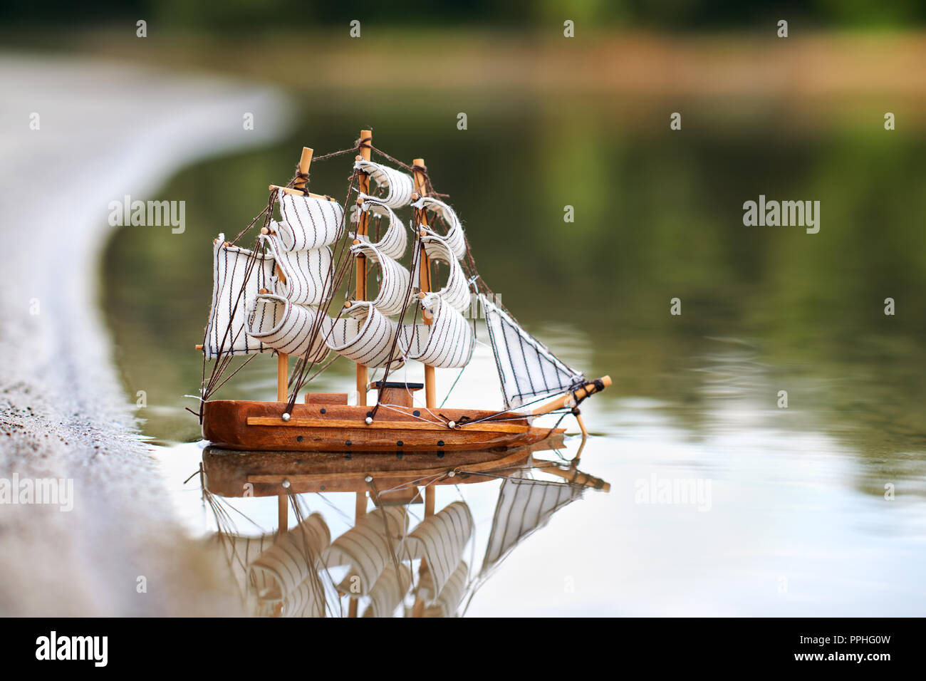a toy sailing ship in the river Stock Photo - Alamy