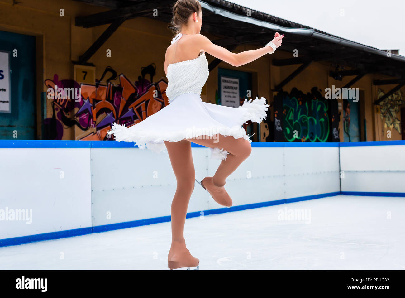 Woman skating on ice rink hi-res stock photography and images - Alamy