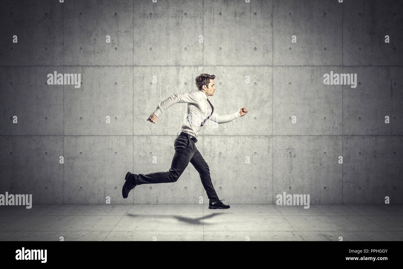 Young happy man running suit hi-res stock photography and images - Alamy