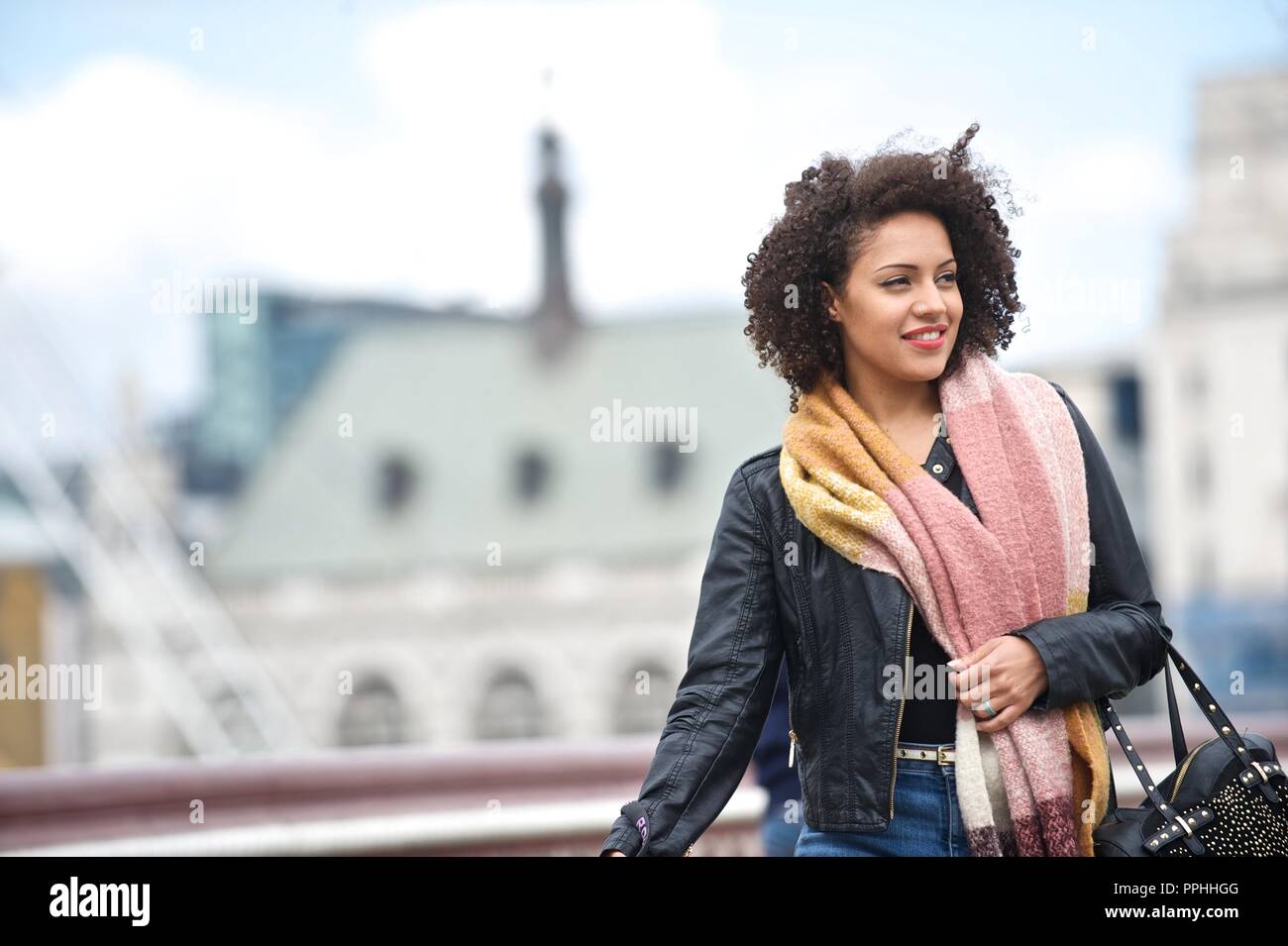 Beautiful mixed race model relaxing outside Stock Photo - Alamy