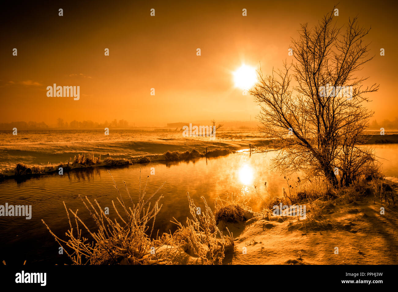 Winter river landscape, moody scenery with morning sun reflection in ...