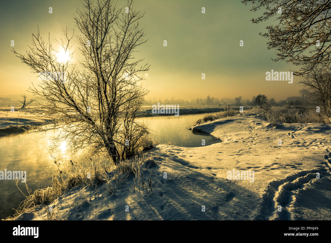 Winter river landscape, moody scenery with morning sun reflection in ...