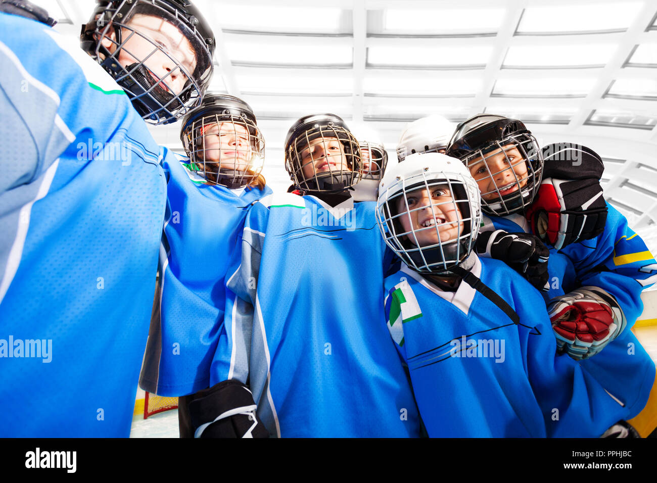 Happy hockey players hugging after successful game Stock Photo - Alamy