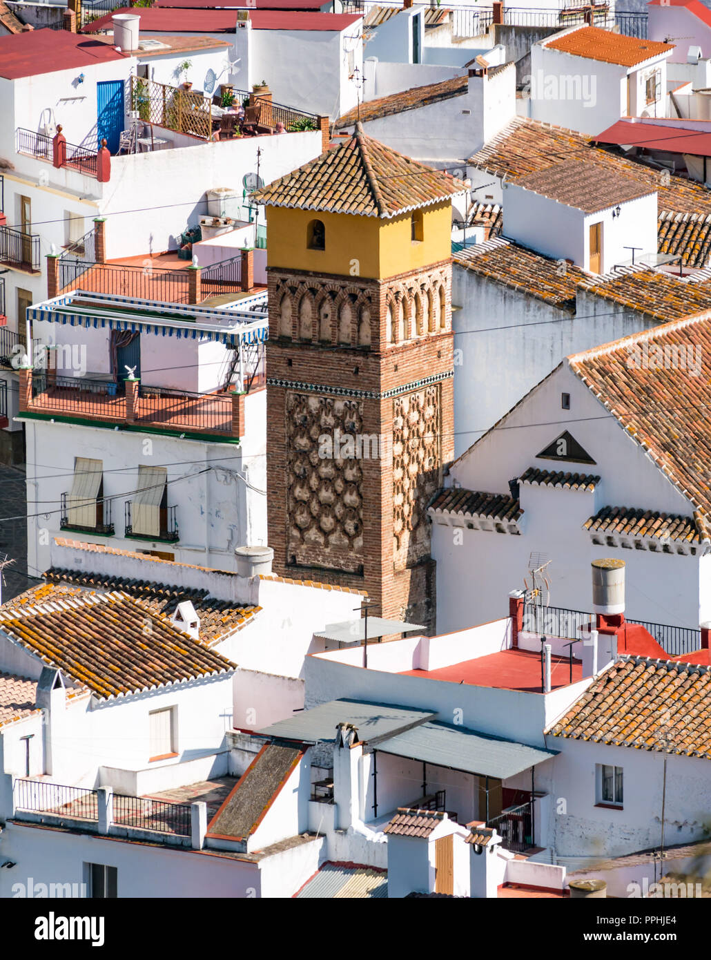 Tiled rooftops and Arabic minaret converted to church tower, Archez ...