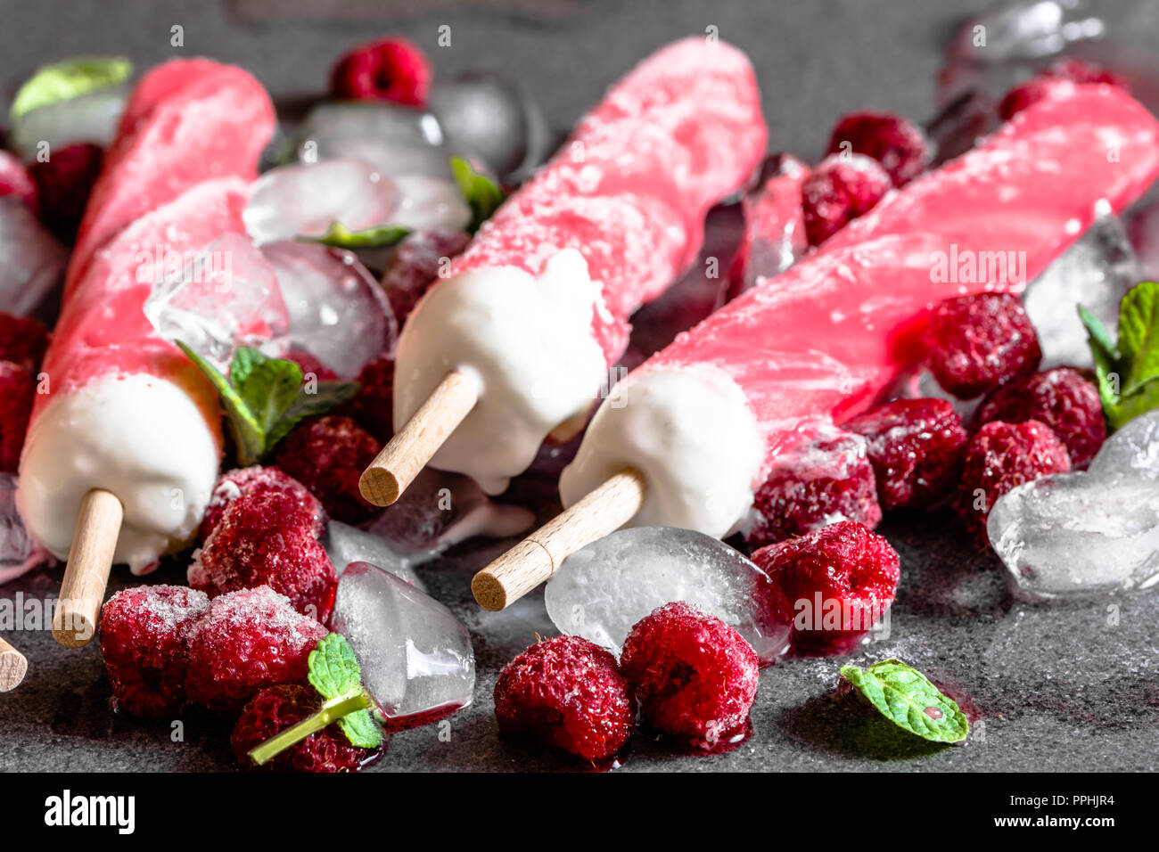 Red ice lolly with summer fruit, cold refreshing snack Stock Photo - Alamy
