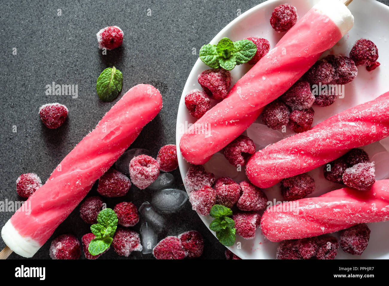 Red ice lolly with summer fruit, cold refreshing snack Stock Photo - Alamy