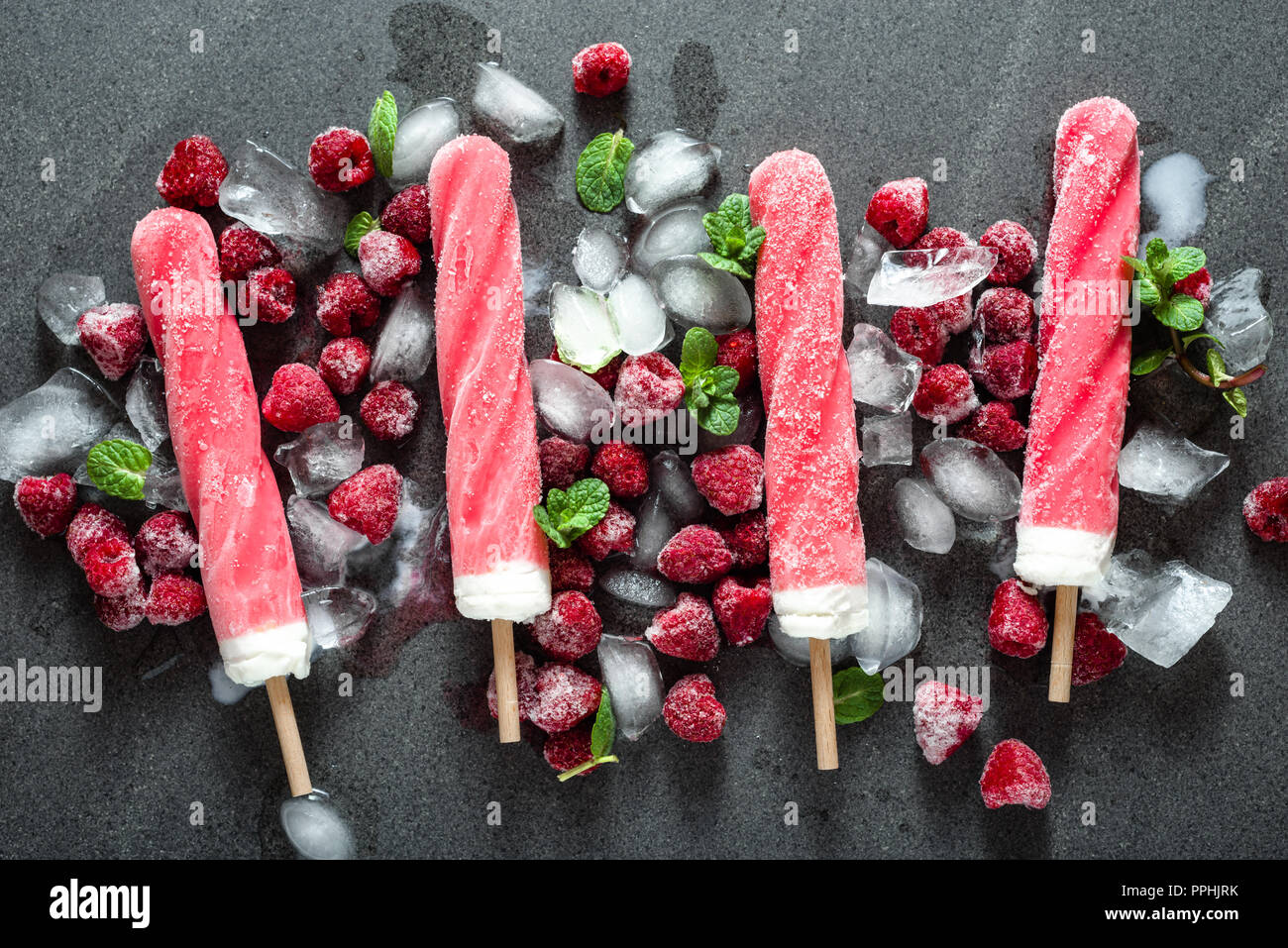 Red ice lolly with summer fruit, cold refreshing snack Stock Photo - Alamy