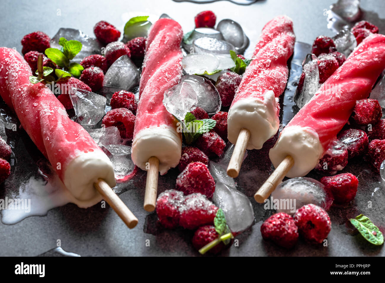 Red ice lolly with summer fruit, cold refreshing snack Stock Photo - Alamy