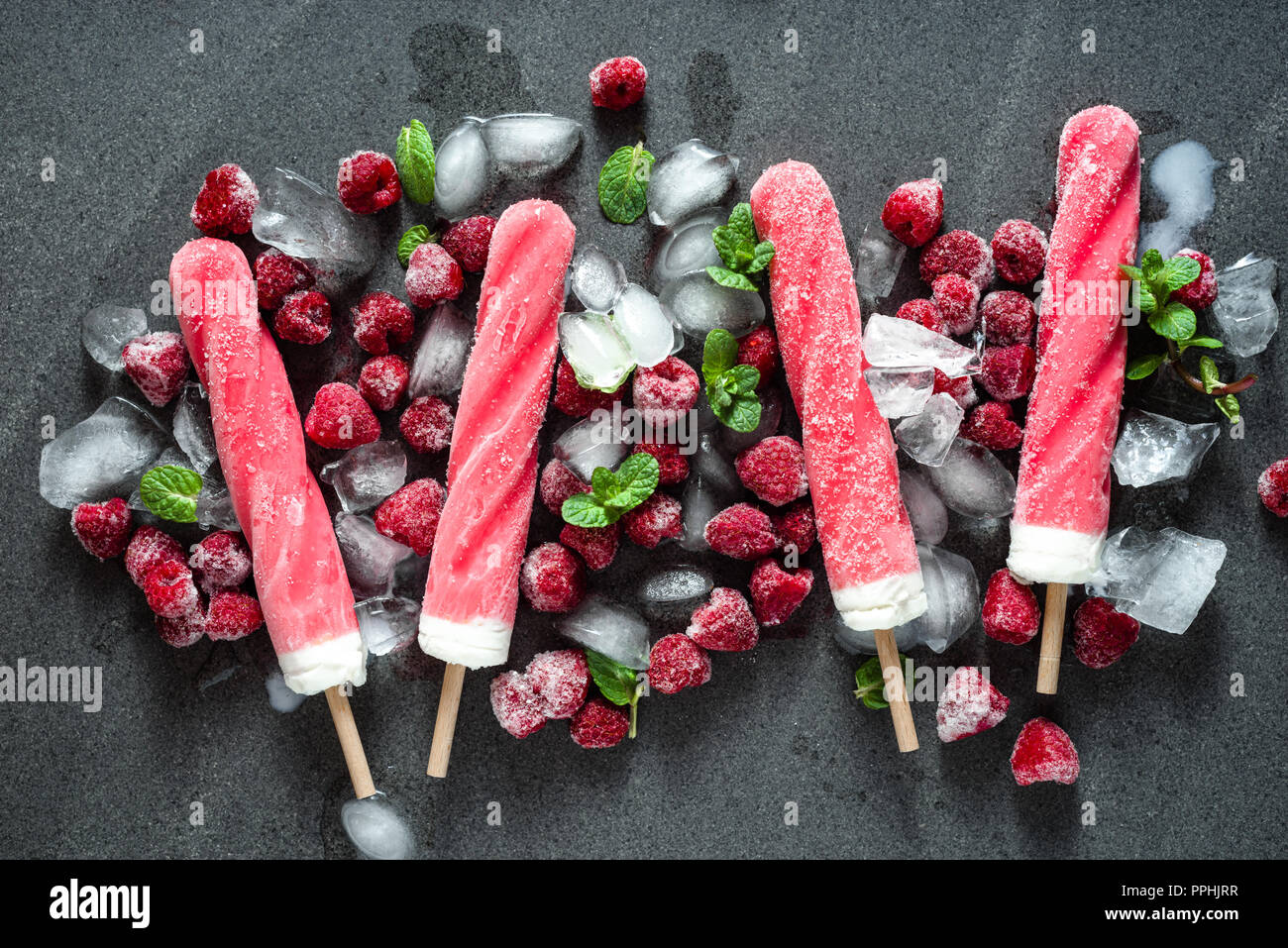 Red ice lolly with summer fruit, cold refreshing snack Stock Photo - Alamy