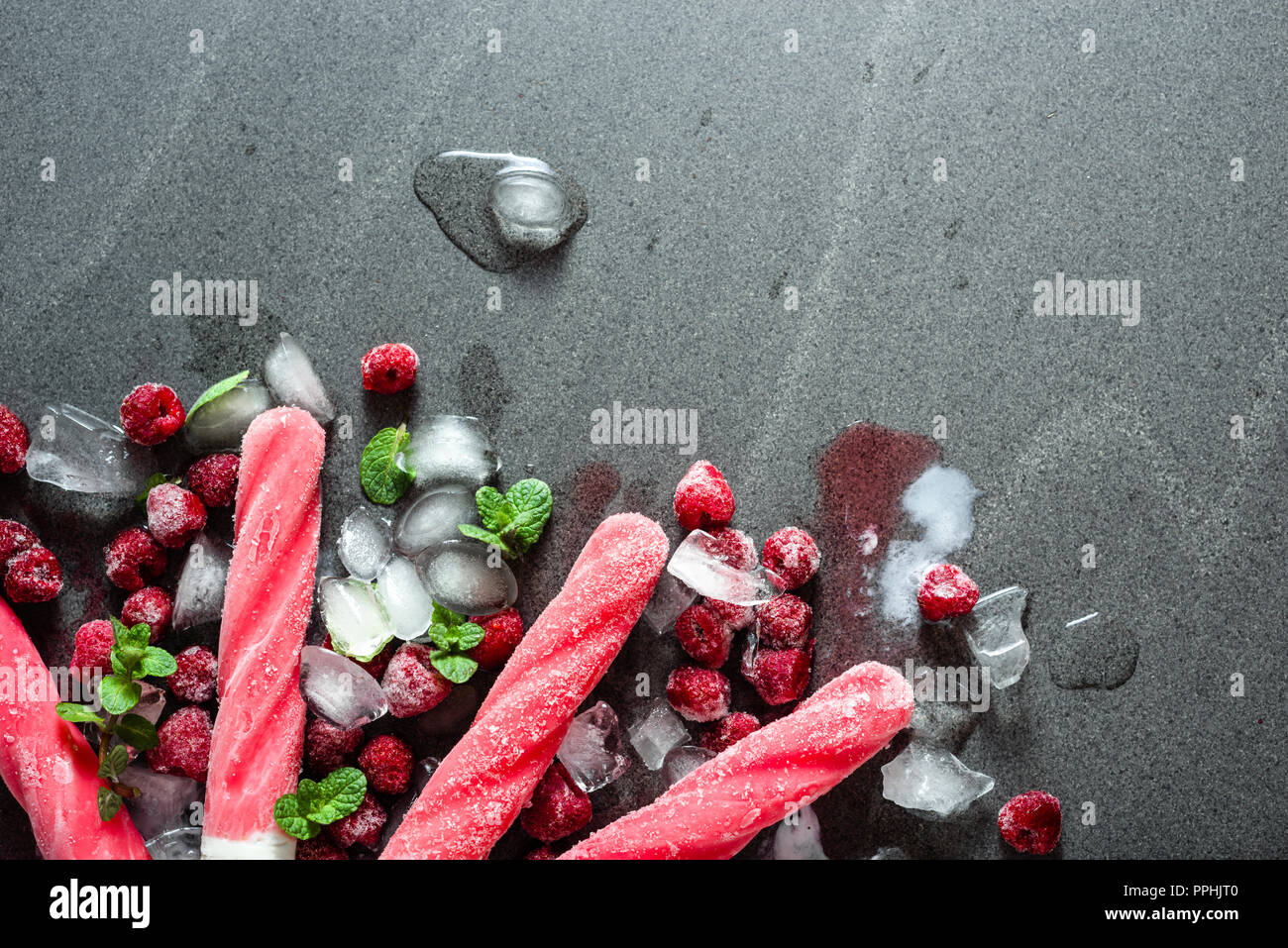 Red ice lolly with summer fruit, cold refreshing snack Stock Photo - Alamy