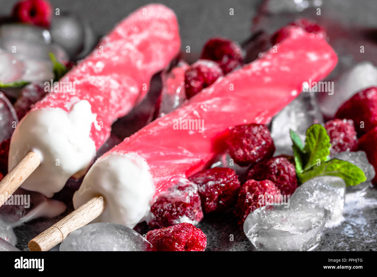 Red ice lolly with summer fruit, cold refreshing snack Stock Photo - Alamy