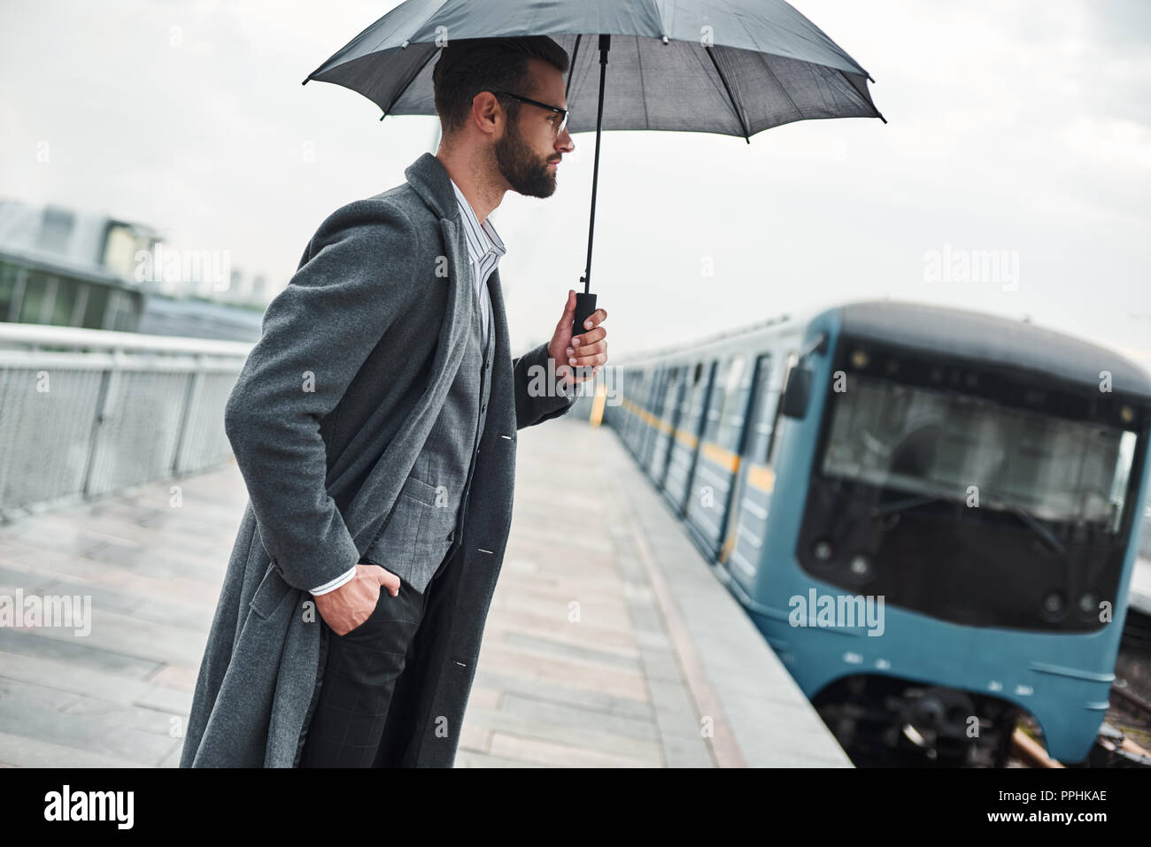 Businessman train station hi-res stock photography and images - Alamy