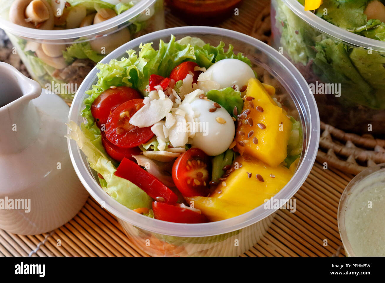 Fresh vegetable salad in an open plastic bowl packing Stock Photo - Alamy