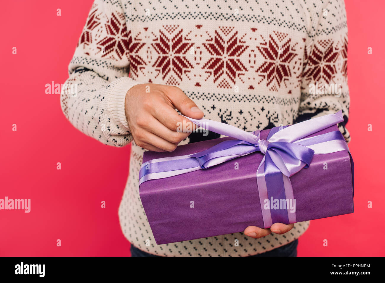 cropped image of man opening gift box isolated on pink Stock Photo - Alamy